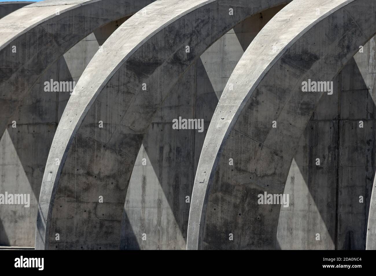 Detail of contemporary concrete construction with curved arched columns ...