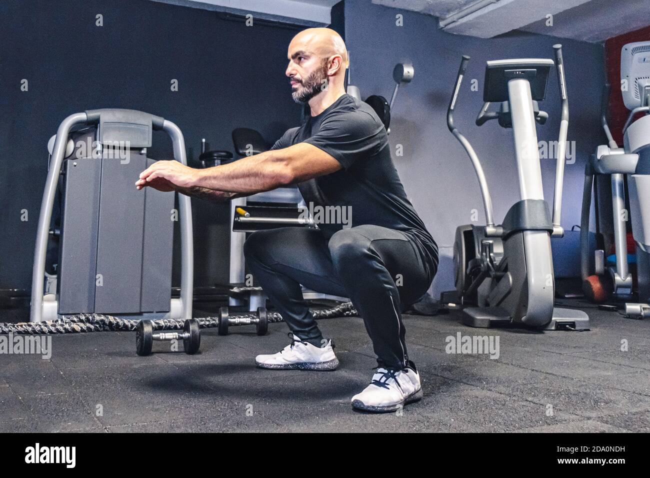 Squat Man High Resolution Stock Photography and Images - Alamy