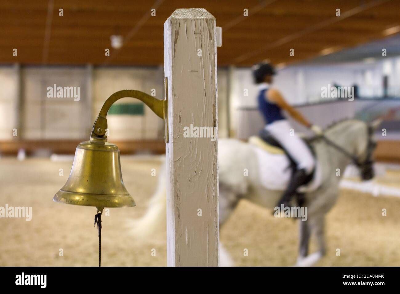 Horizontal shot of a Judge Bell with female dressage horse rider in the ...