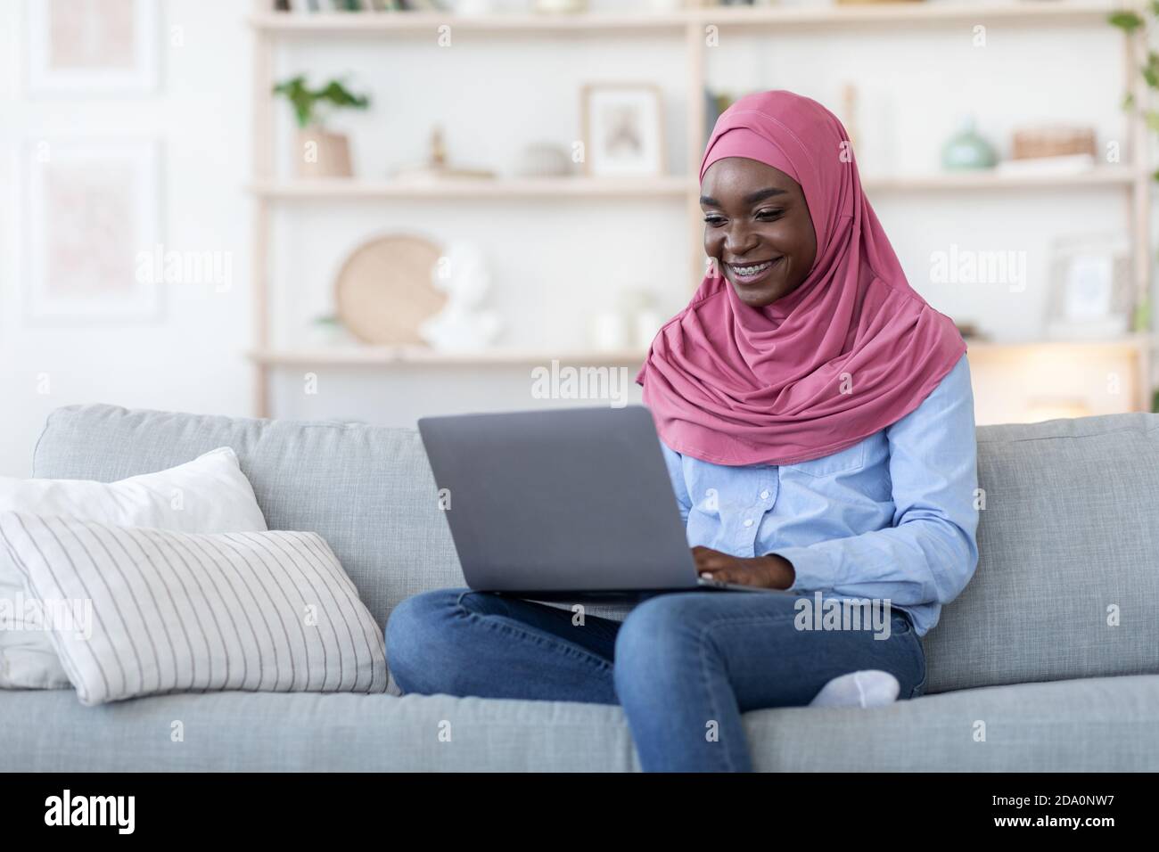 Remote Work. Smiling African Muslim Lady In Hijab Using Laptop At Home ...