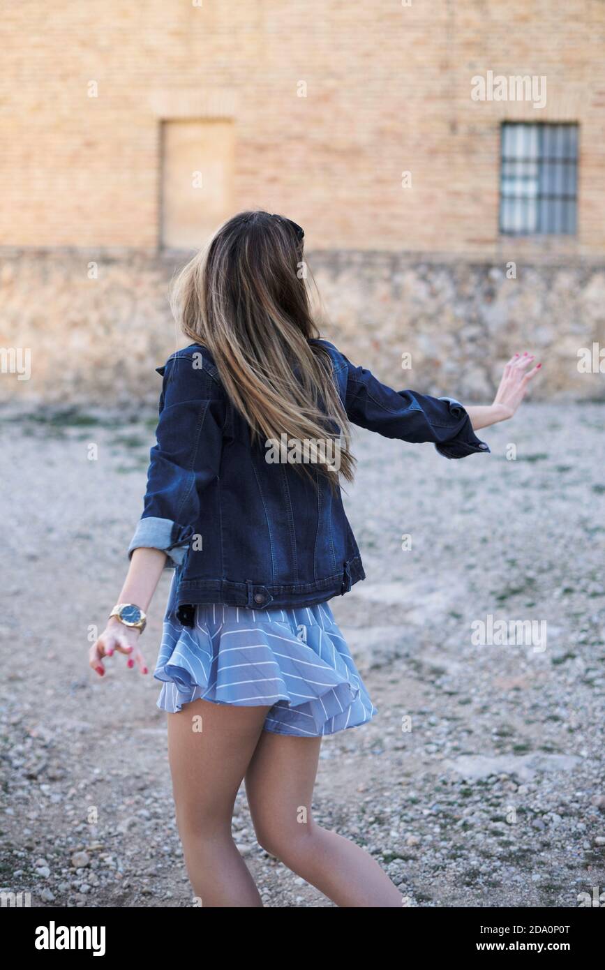 Young lady turning around hi-res stock photography and images - Alamy