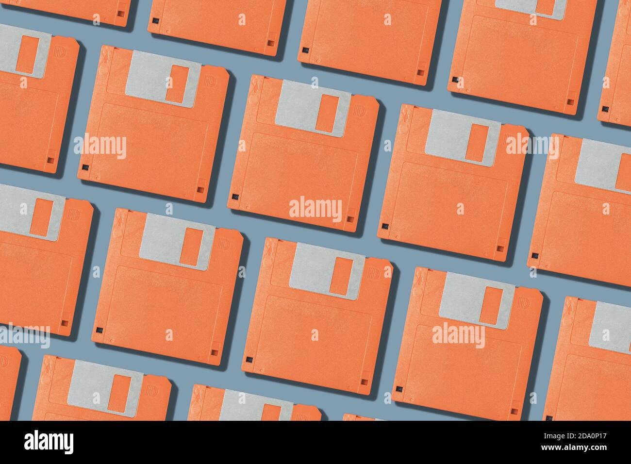 Top view layout with set of vintage orange computer floppy disks ...