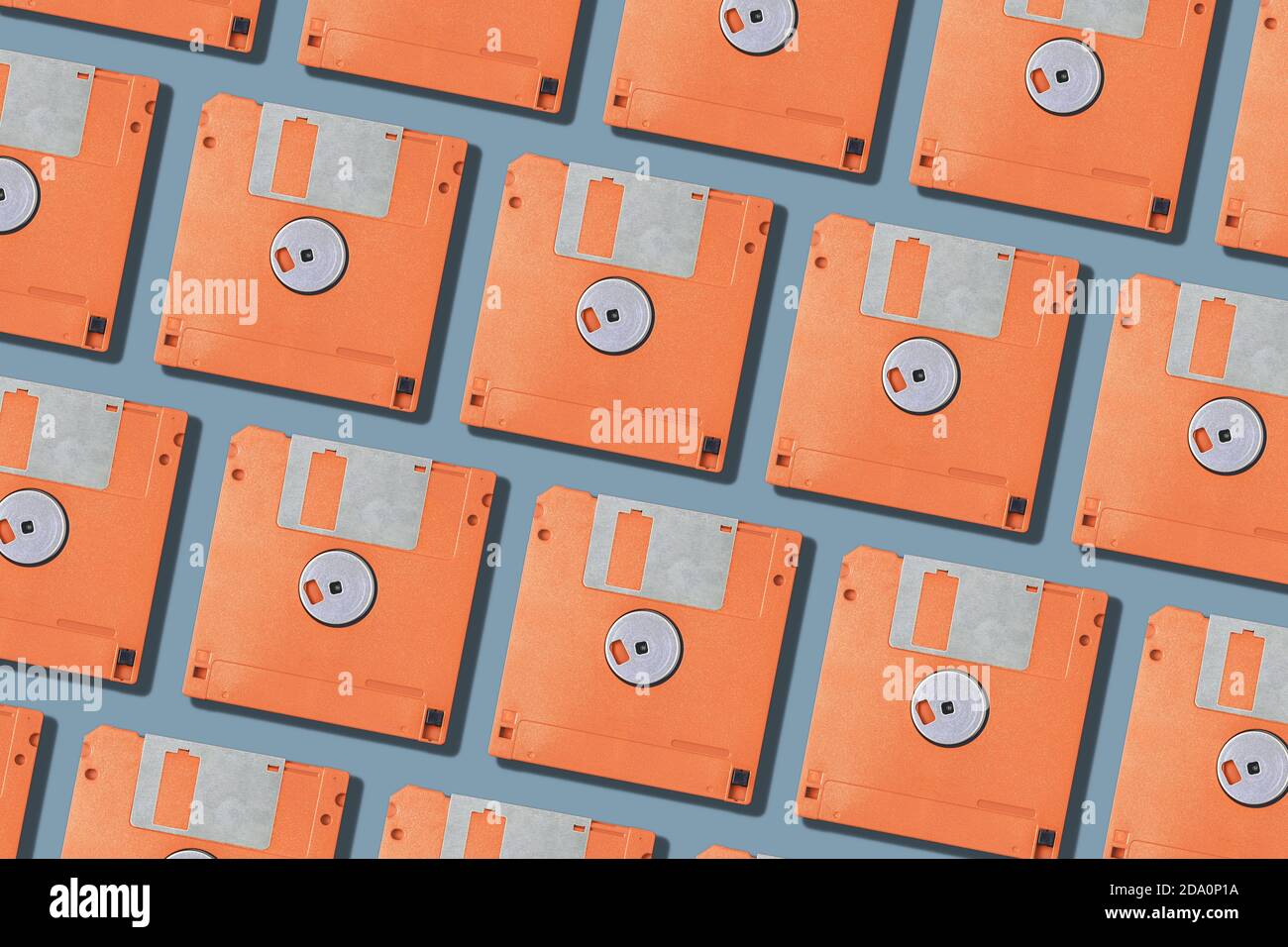 Top view layout with set of vintage orange computer floppy disks ...