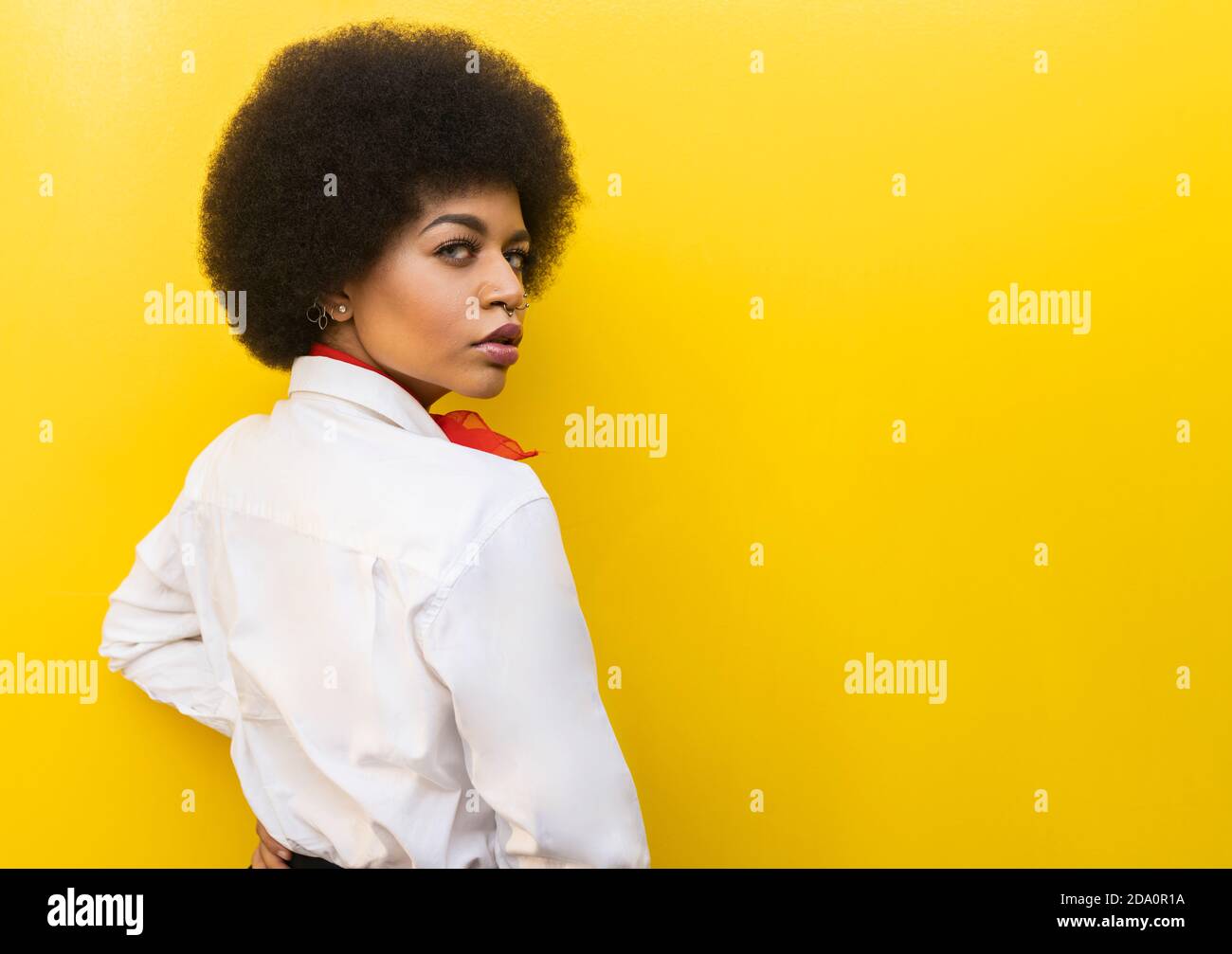 back view of confident African American female in elegant formal outfit ...