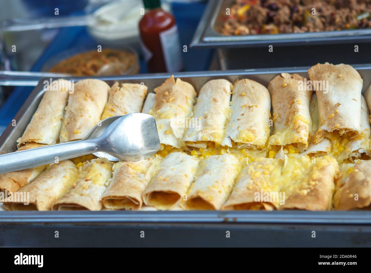 Pancakes stuffed with boiled corn. A tray with pancakes Stock Photo - Alamy