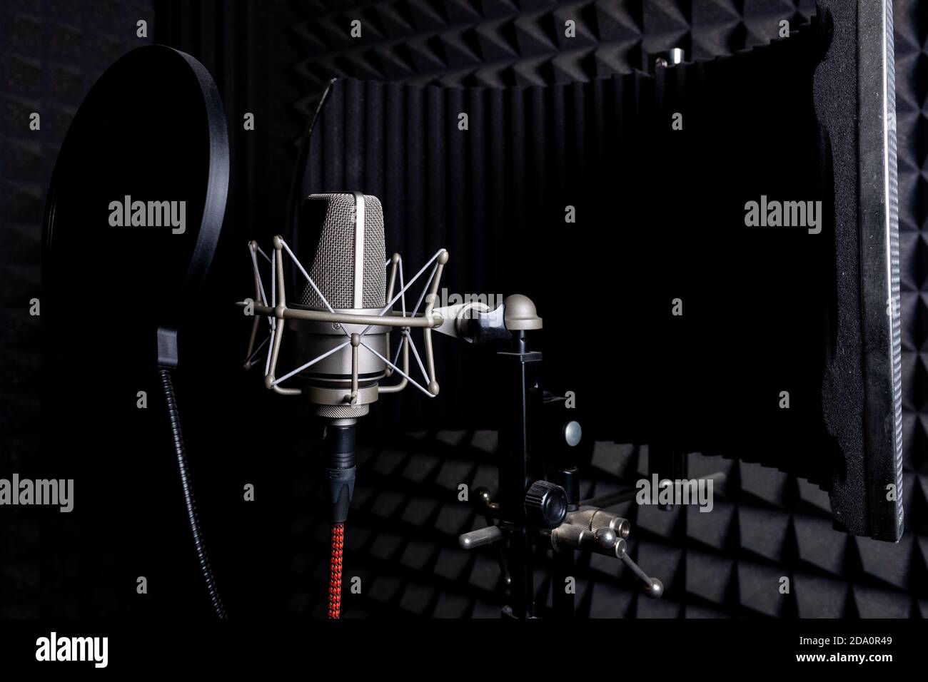 Contemporary metal microphone with wire placed on background of ...