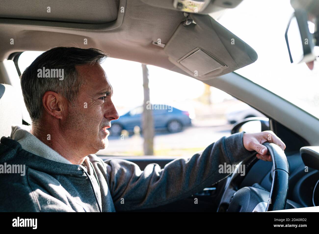 Senior retired man driving car Stock Photo - Alamy