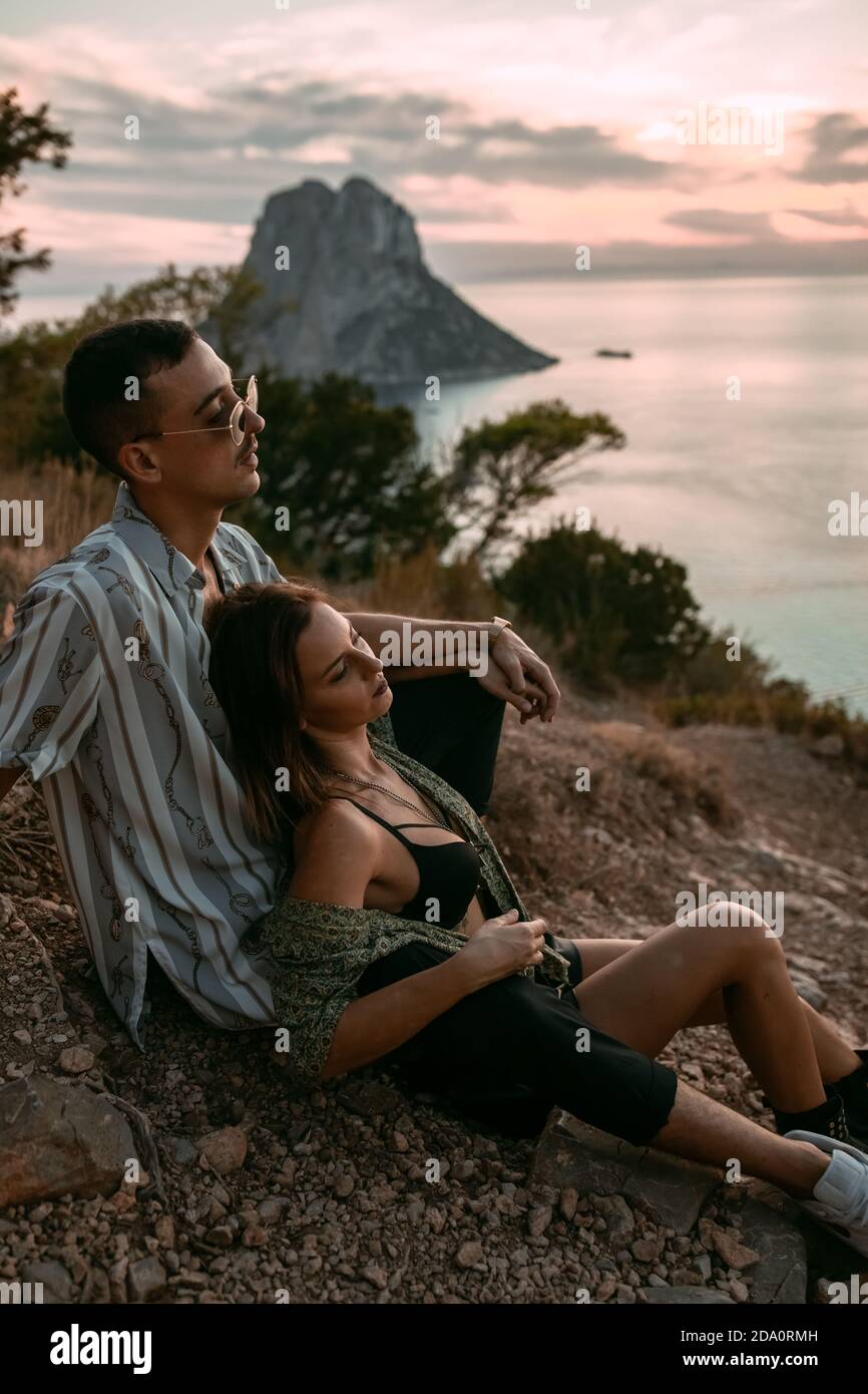 Couple embrace on hill sunset hi-res stock photography and images - Alamy