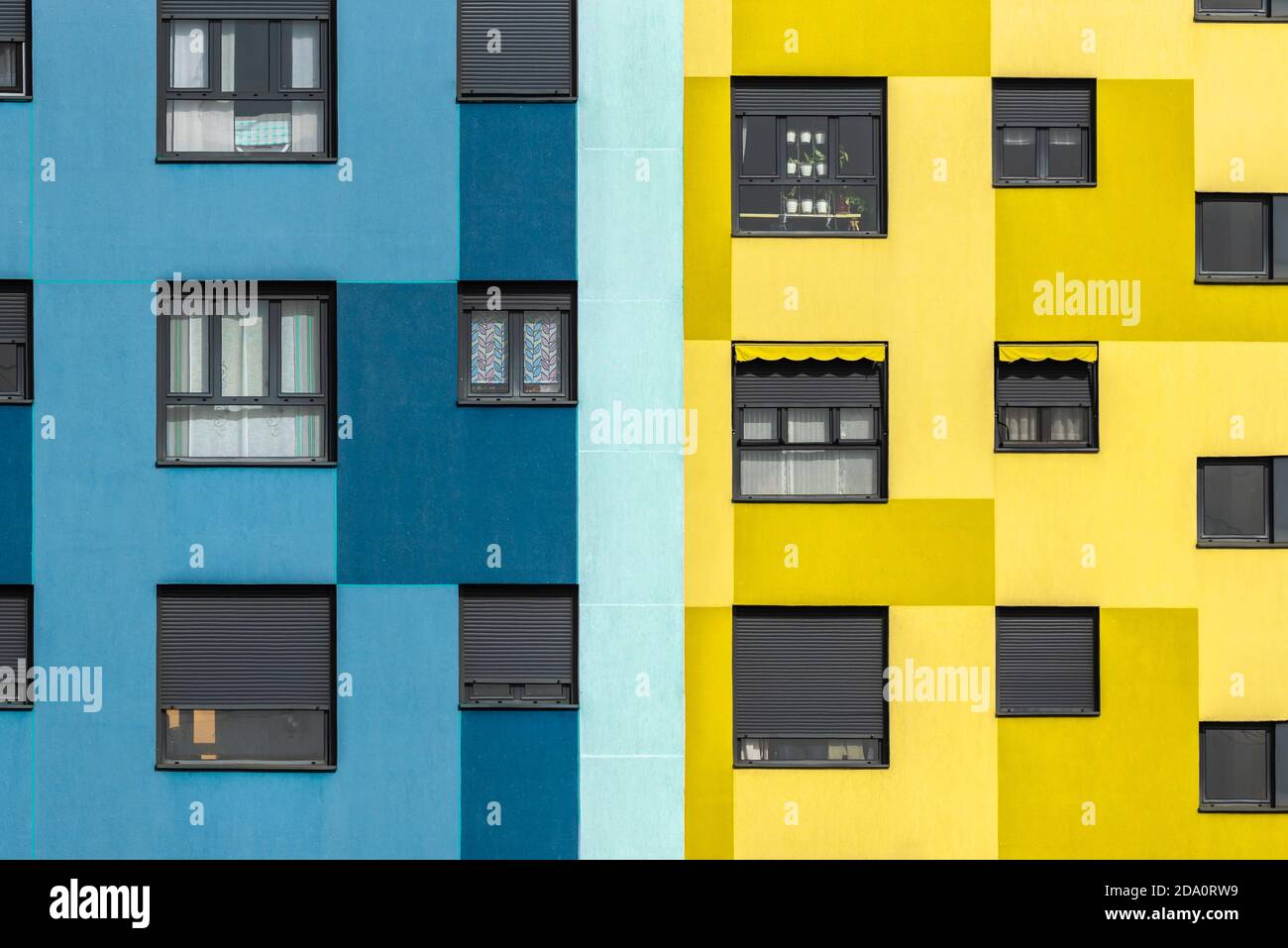 Background of blue and yellow exterior of residential building with ...