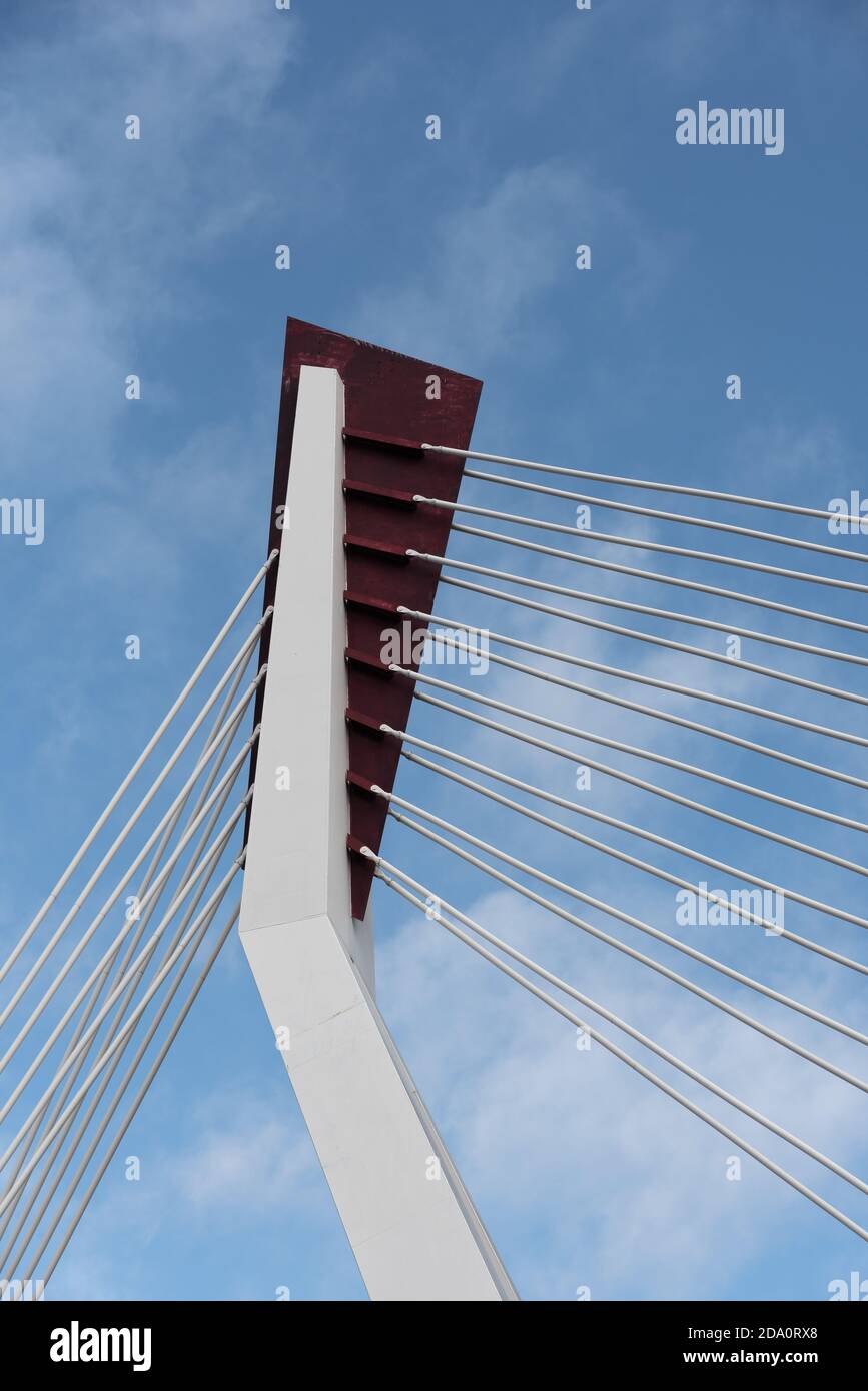 From below of white contemporary suspension bridge with high column ...