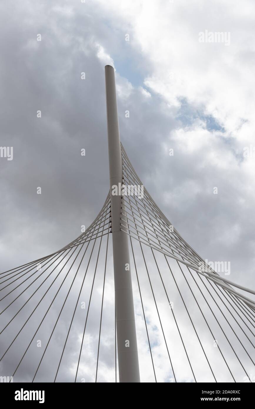 From below of white contemporary suspension bridge with high column ...