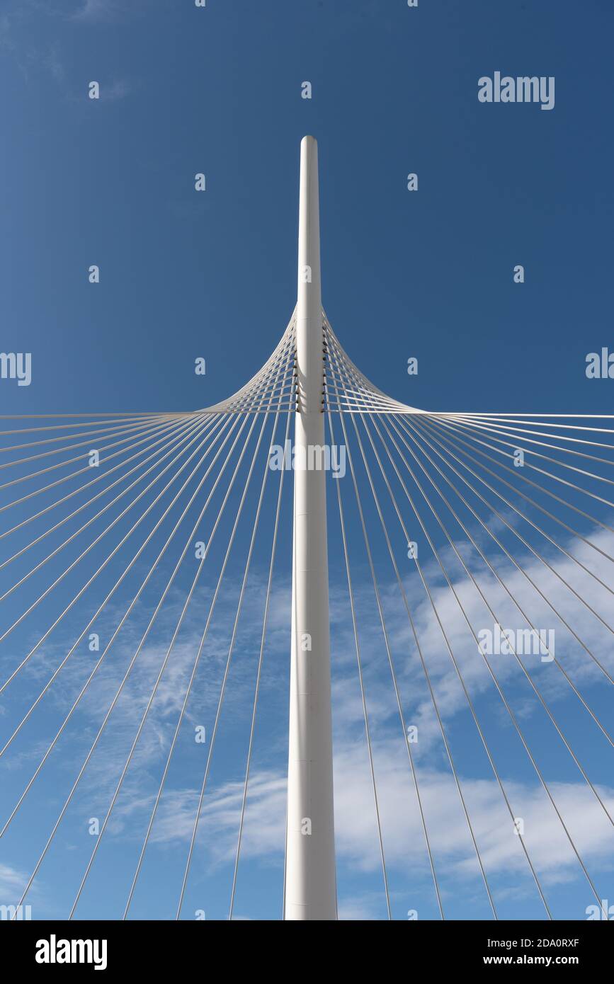 From below of white contemporary suspension bridge with high column ...