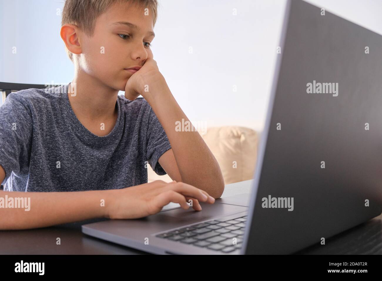 Teenage boy using laptop computer at home. Technology, online learning ...