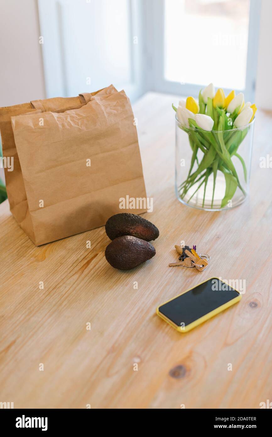 Still life with fresh fruit and smartphone in dining table with some ...