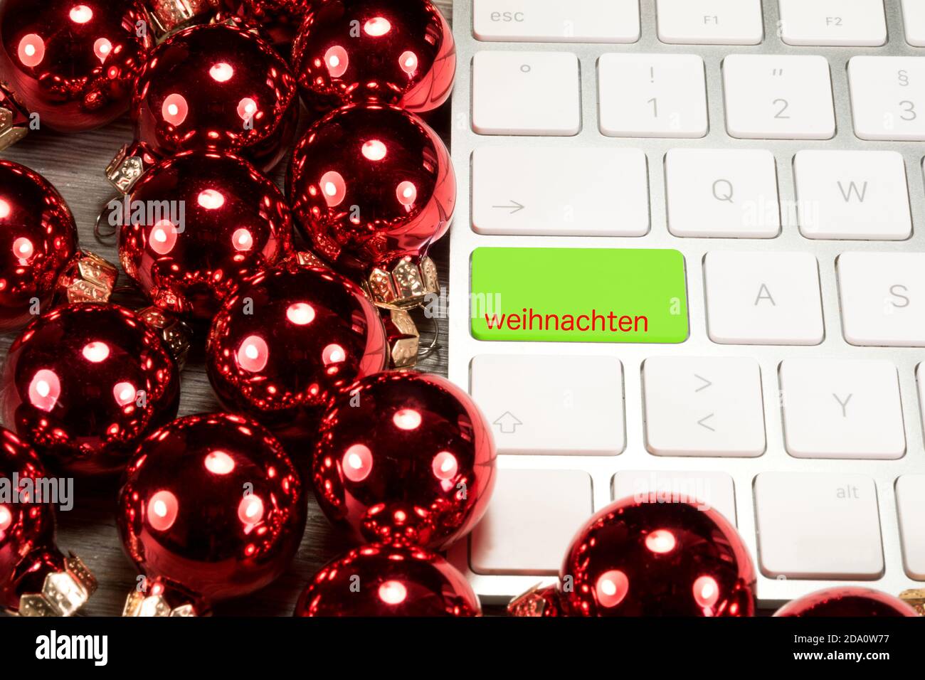 Christmas balls and computer keyboard Stock Photo - Alamy