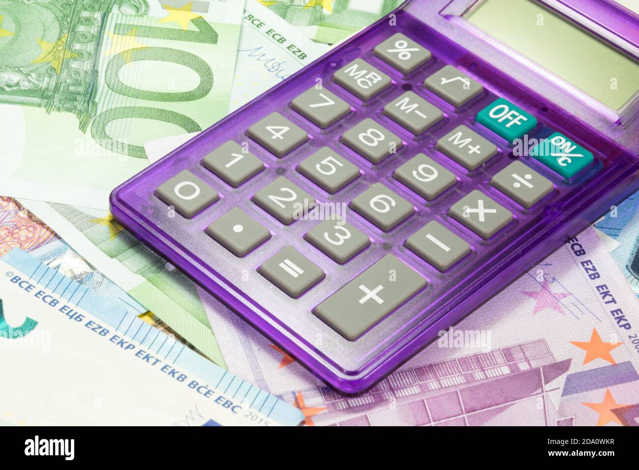 Euro banknotes and a calculator Stock Photo - Alamy