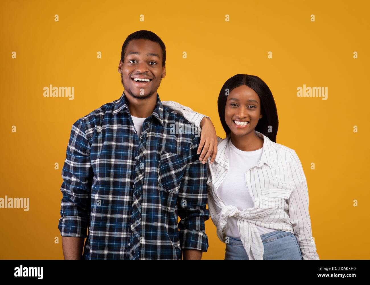 Smiling Millennial African American Couple In Love In Casual Look Into