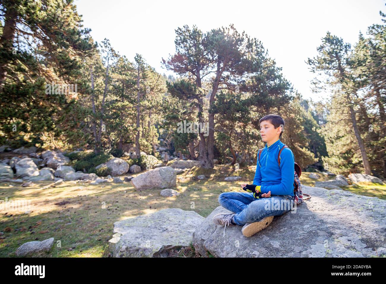Boy Sitting On Stone High Resolution Stock Photography and Images - Alamy