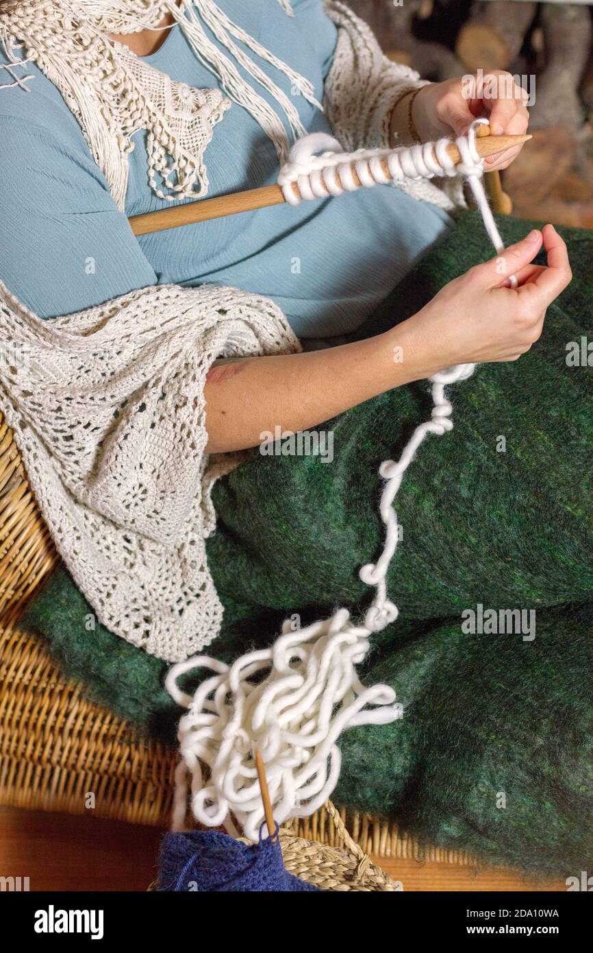 Adult Woman knitting in cosy room Stock Photo - Alamy