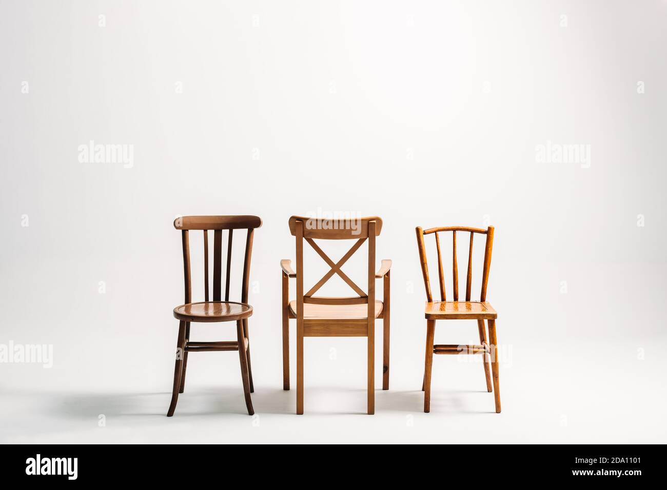 Studio shot of three classical wooden chairs Stock Photo - Alamy