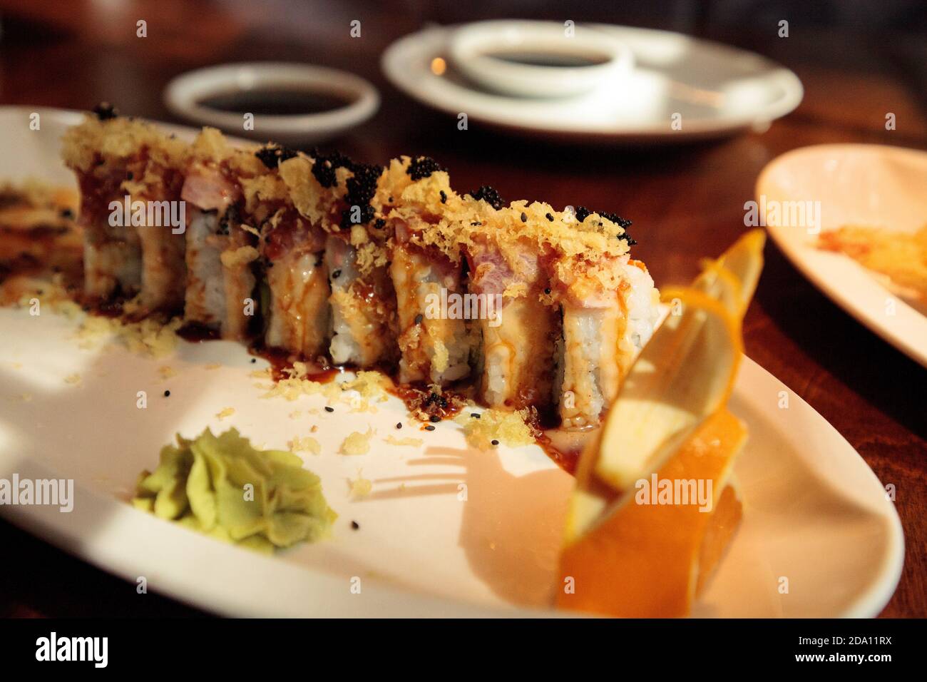 Crispy tuna sushi roll with tempura in the center with rice and masago ...