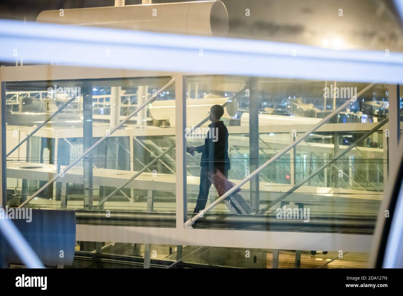 Paris, France. 08th Nov, 2020. A passenger boards an aircraft at Paris ...