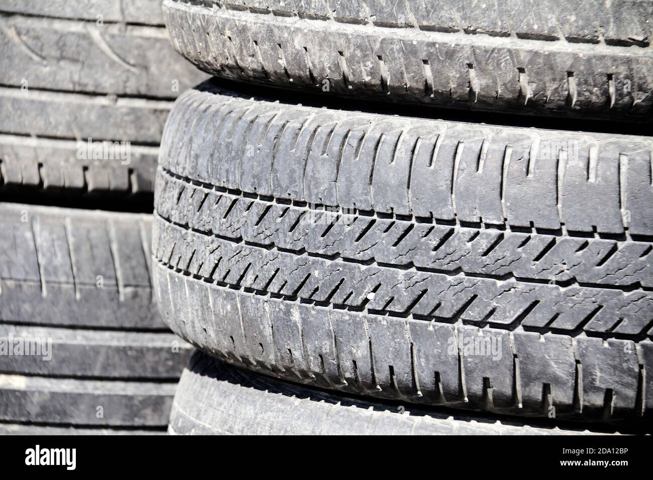 Pile of used rubber tyres Stock Photo - Alamy