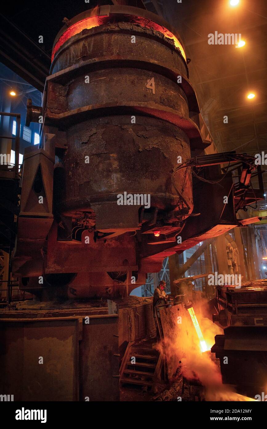 Steel production in electric furnaces. Sparks of molten steel. Electric ...