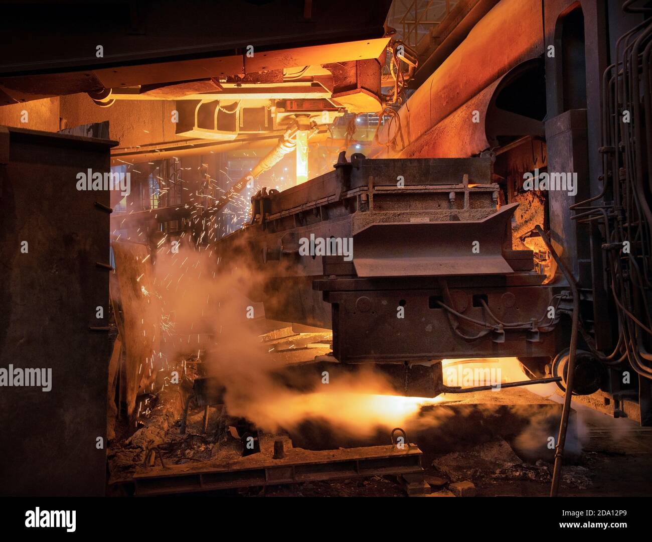 Steel production in electric furnaces. Sparks of molten steel. Electric ...