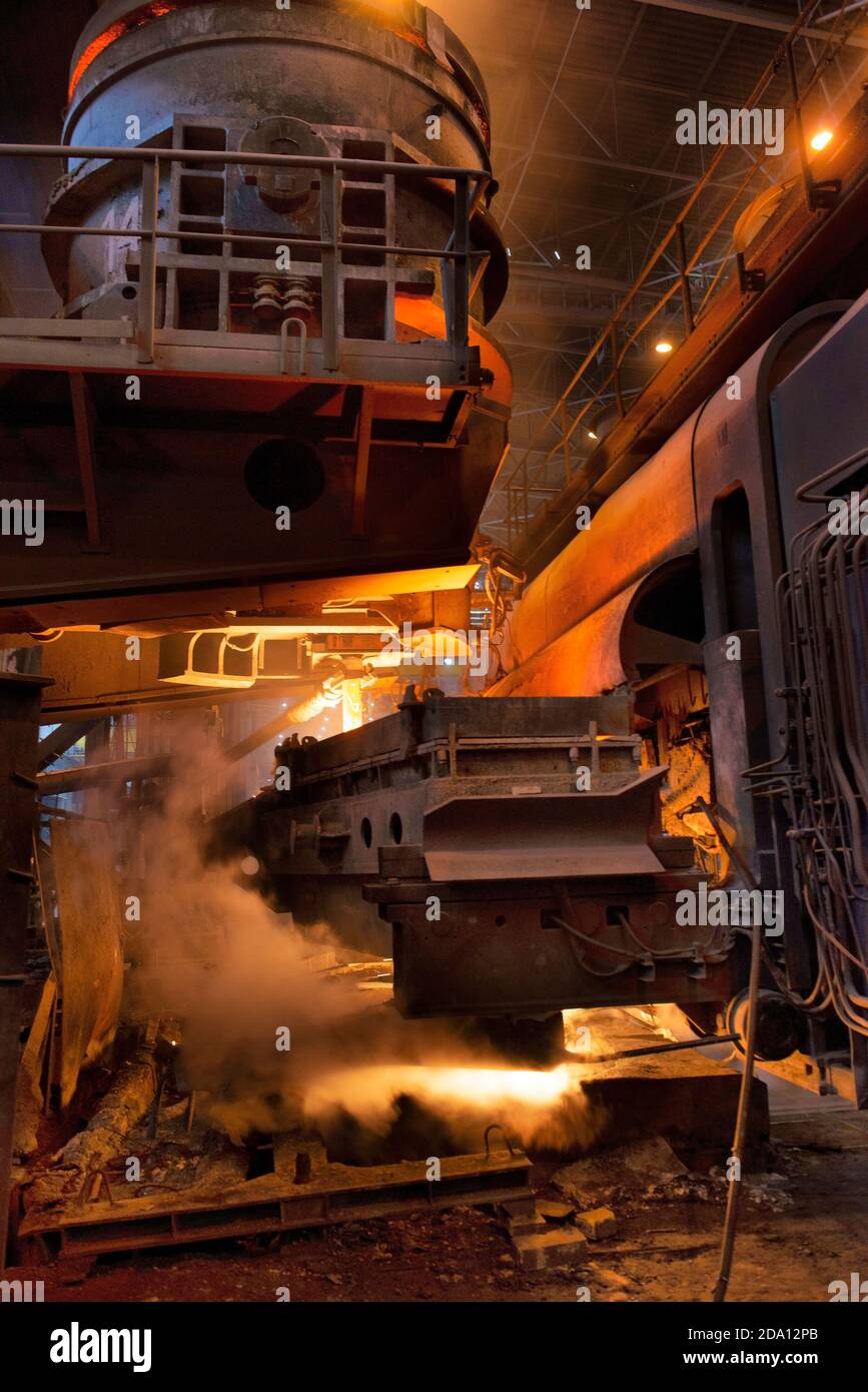 Steel production in electric furnaces. Sparks of molten steel. Electric ...