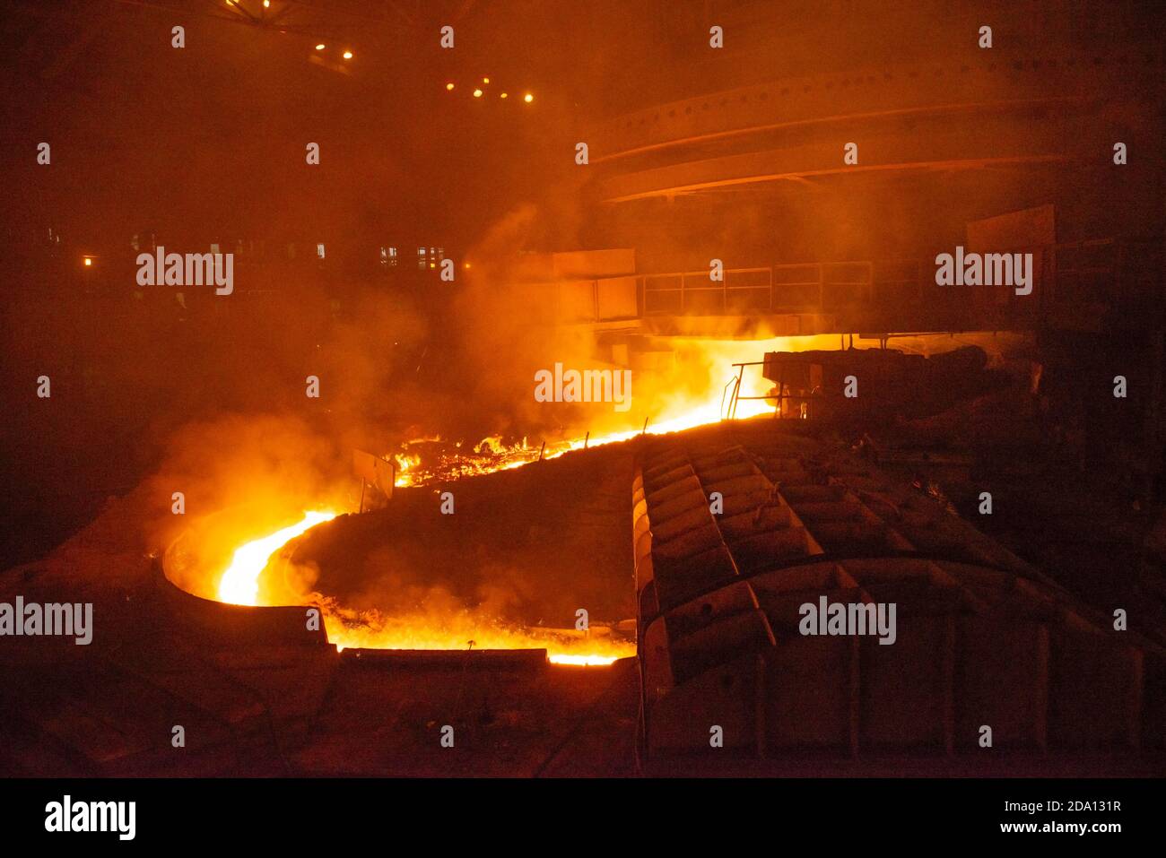 blast furnace iron tapping. Hot steel is poured into another pan Stock ...