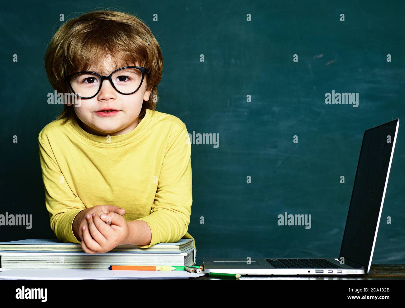 Schoolkid or preschooler learn. Little student boy happy with an ...