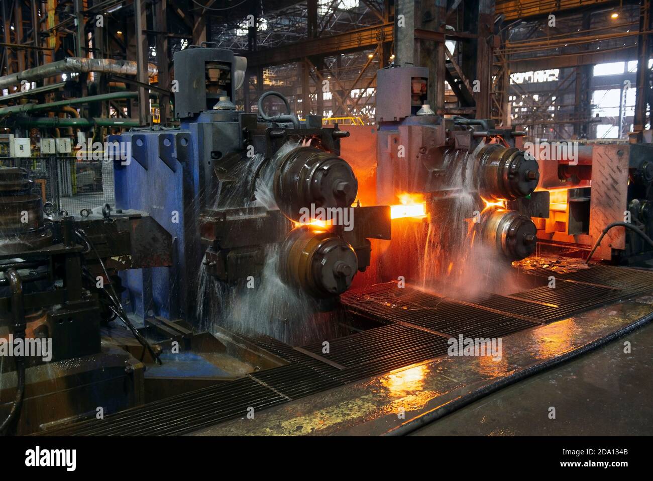 hot steel on conveyor in a steel mill. hot rolled rebar Stock Photo - Alamy