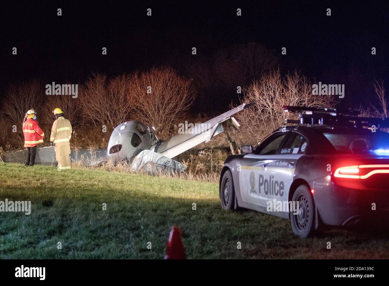 Plane crashed with some firefighters and a car police in front Stock ...