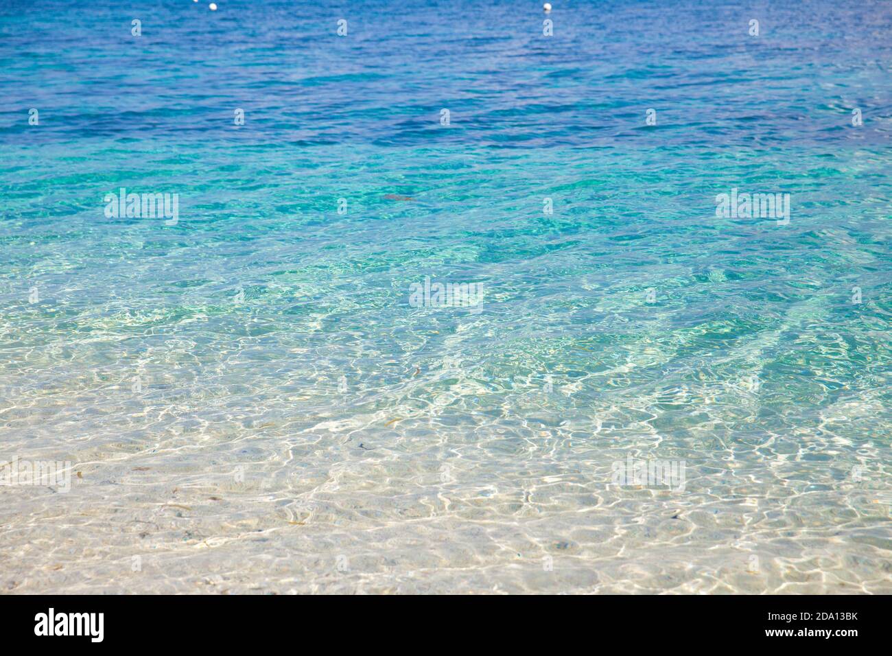 Aerial footage of a perfectly crystal clear blue turquoise water ...