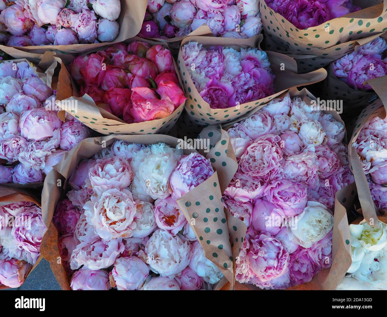 Bouquets of peonies in paper packaging. Flower shop Stock Photo - Alamy