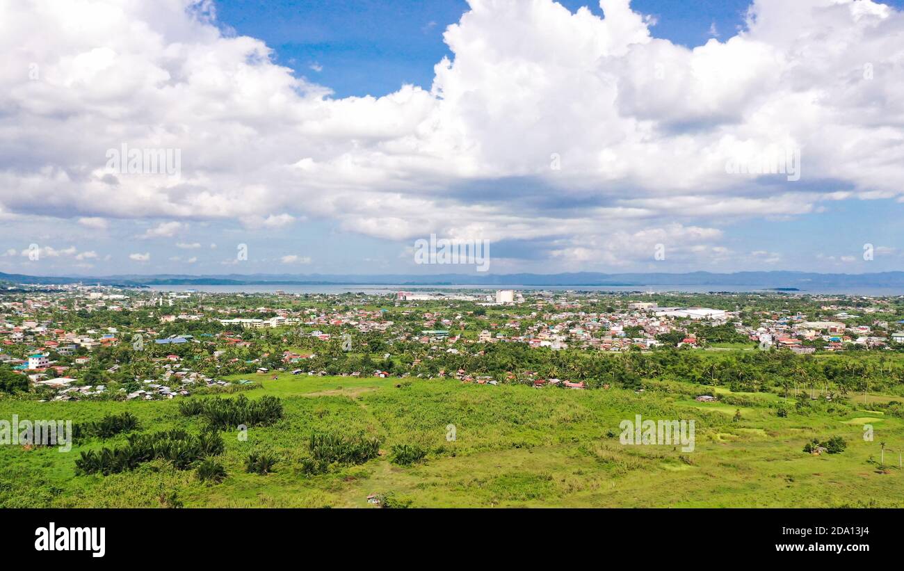 Tropical landscape with panorama of Tacloban, aerial view. Town and sky ...
