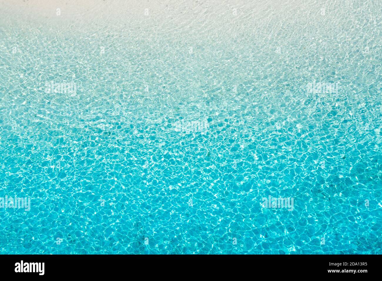 Aerial footage of a perfectly crystal clear blue turquoise water ...