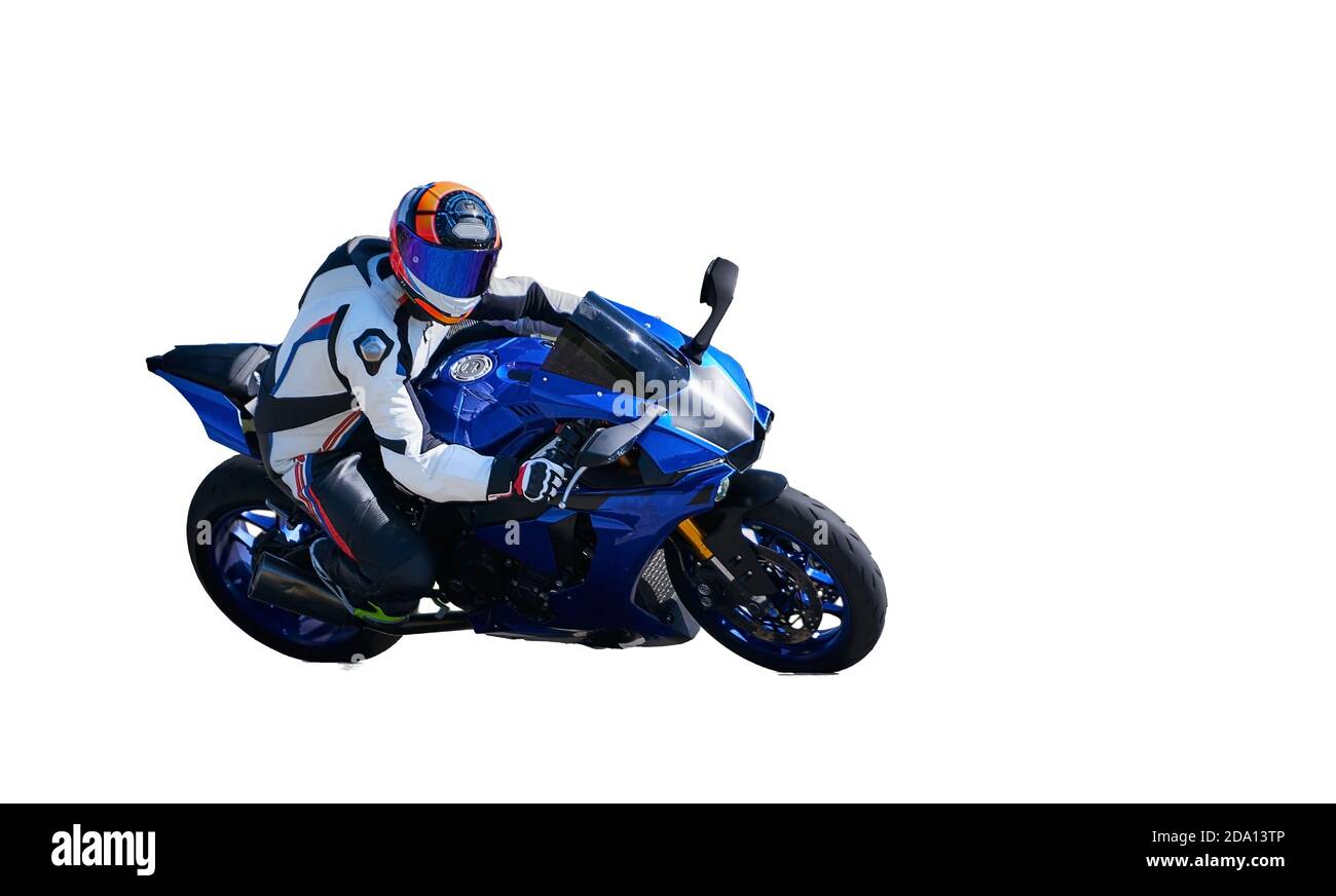 Motorcycle practice leaning into a fast corner on track Stock Photo - Alamy