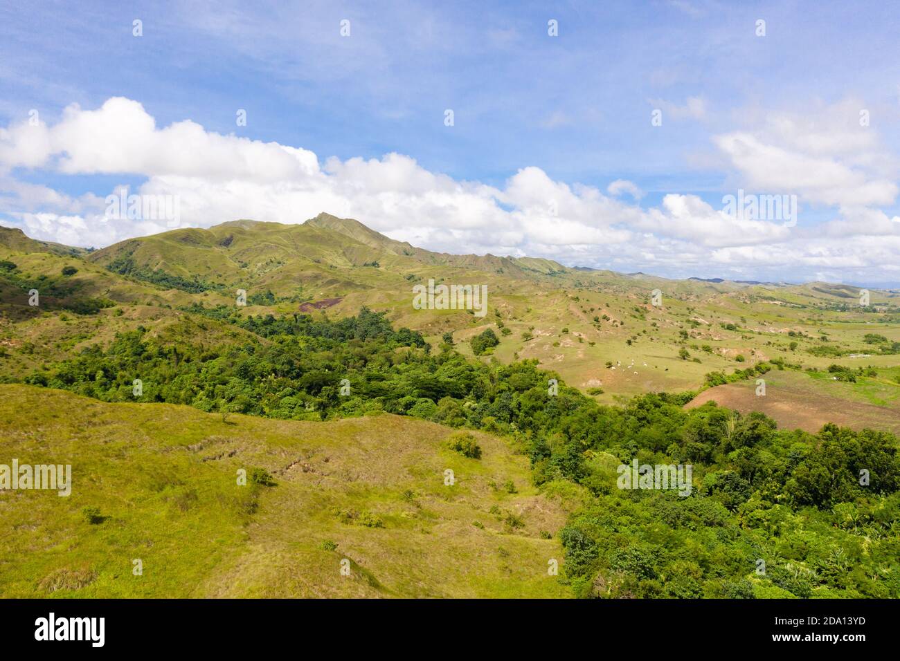 Green hills and blue sky with clouds. Beautiful landscape on the island ...