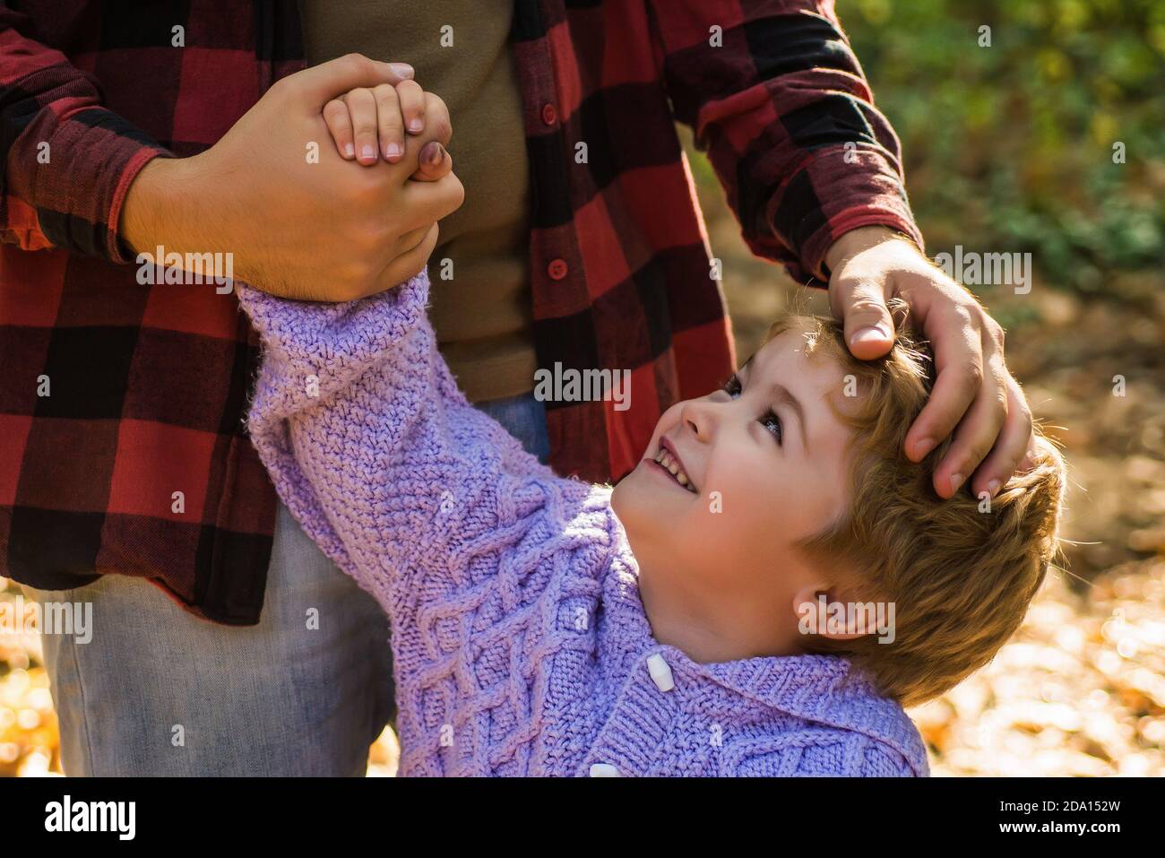 Fathers Parental support. Help kid explore world. Dad hold hand of ...