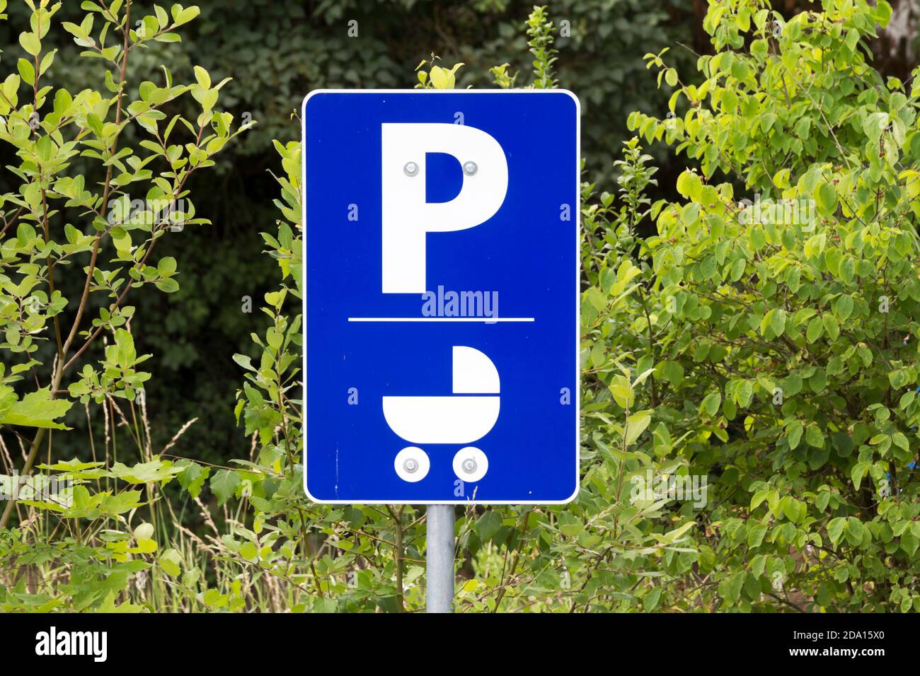 a signpost marking a parking area especially for women with babies ...