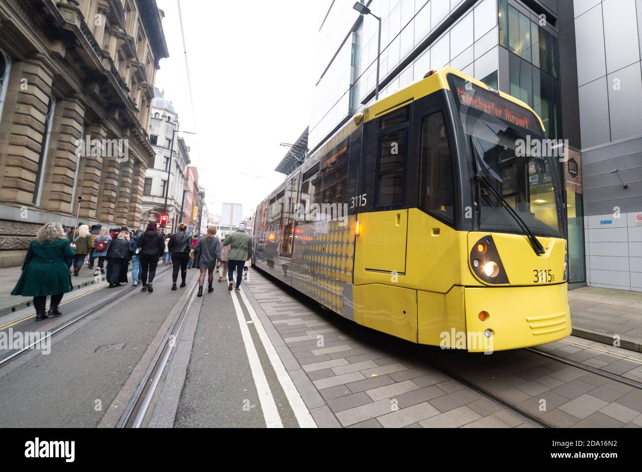Protesters in manchester against the lockdown walk along the tramlines ...