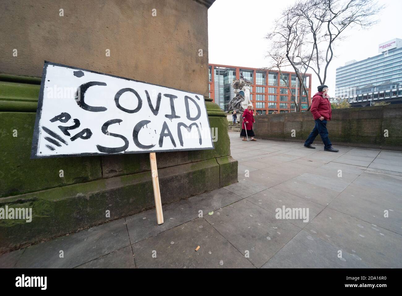 Manchester 08-11-2020 Piccadilly Gardens - a Covid Scam sign or placard ...