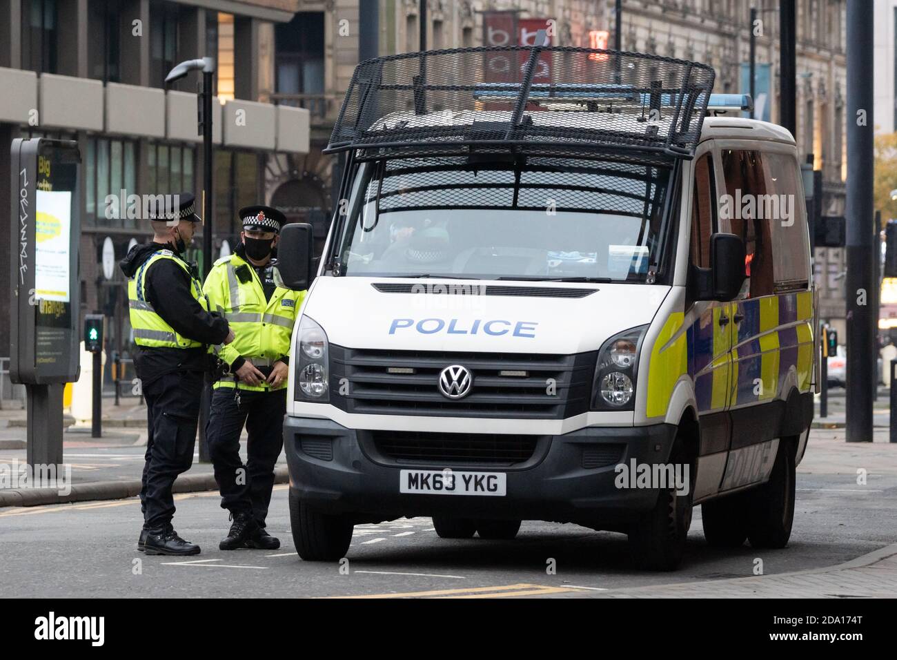 Police talking to a colleague in the drivers seat of the VW riot van in ...
