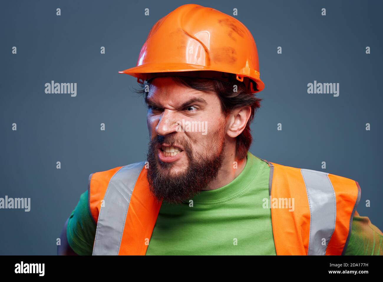 emotional man worker orange paint hard work Stock Photo - Alamy