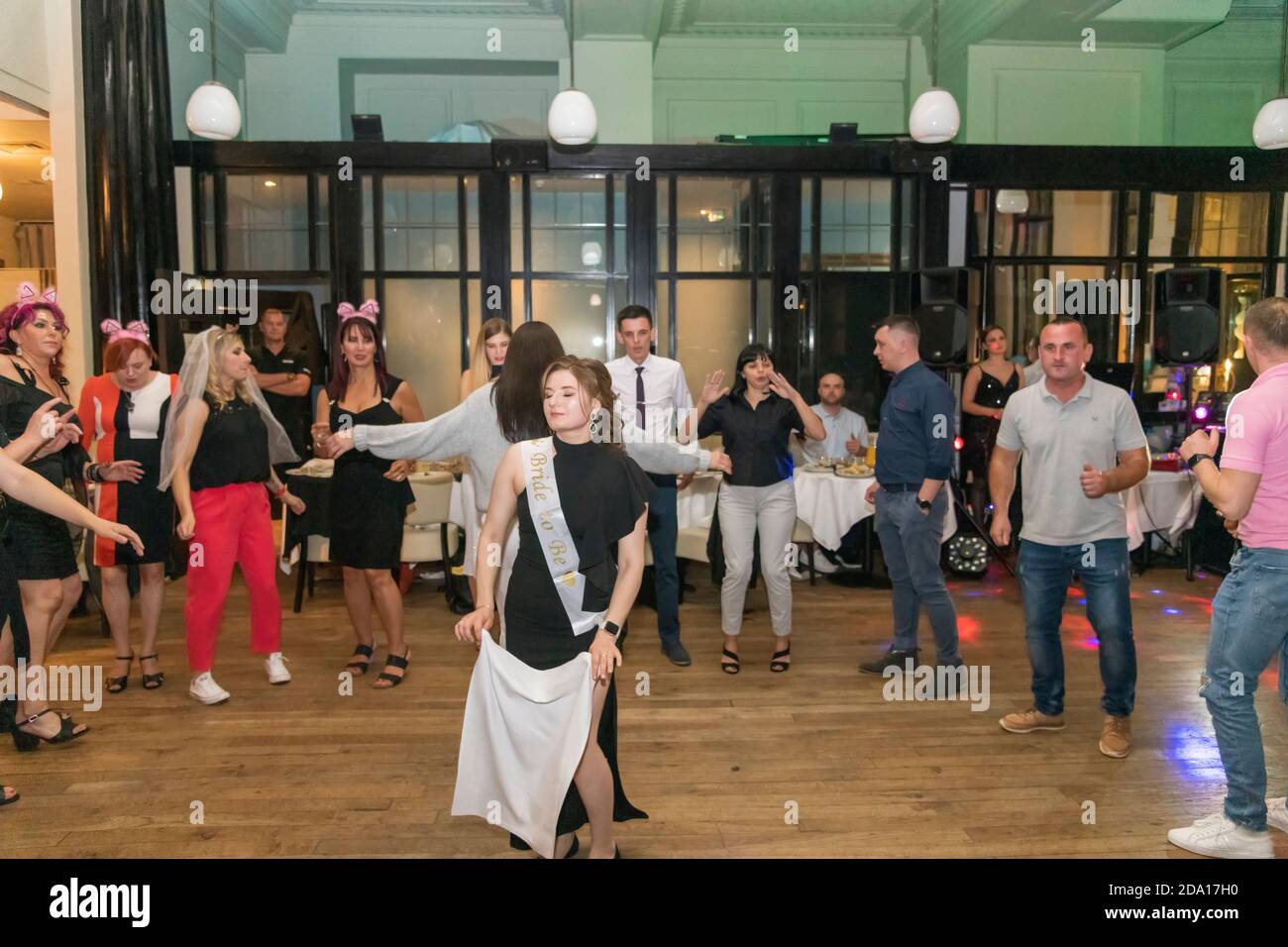Portrait of young beautiful woman dancing with restaurant in the ...