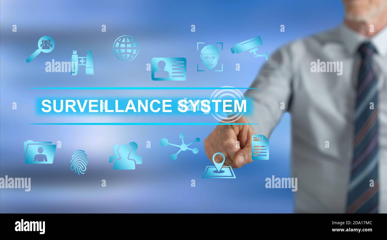Man touching a surveillance system concept on a touch screen with his ...
