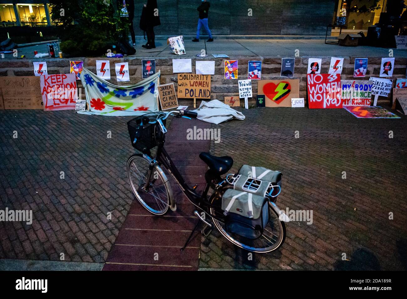 A bike is placed in front of the placards lying on the ground after the ...