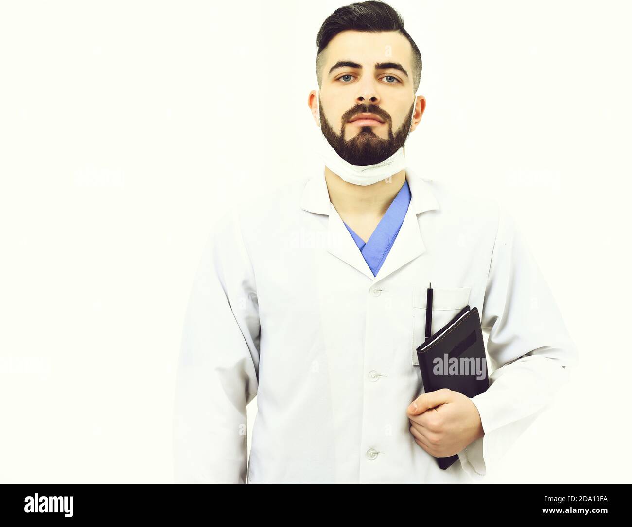 Doctor with beard holds notebook with history of present illness ...